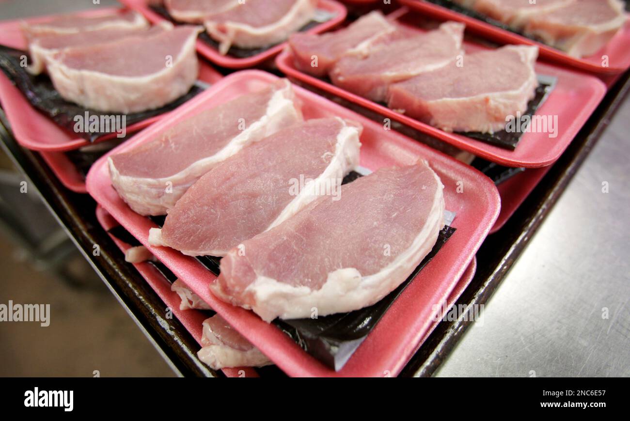 Boneless pork loins sit waiting to be packaged at a local Dahl's ...