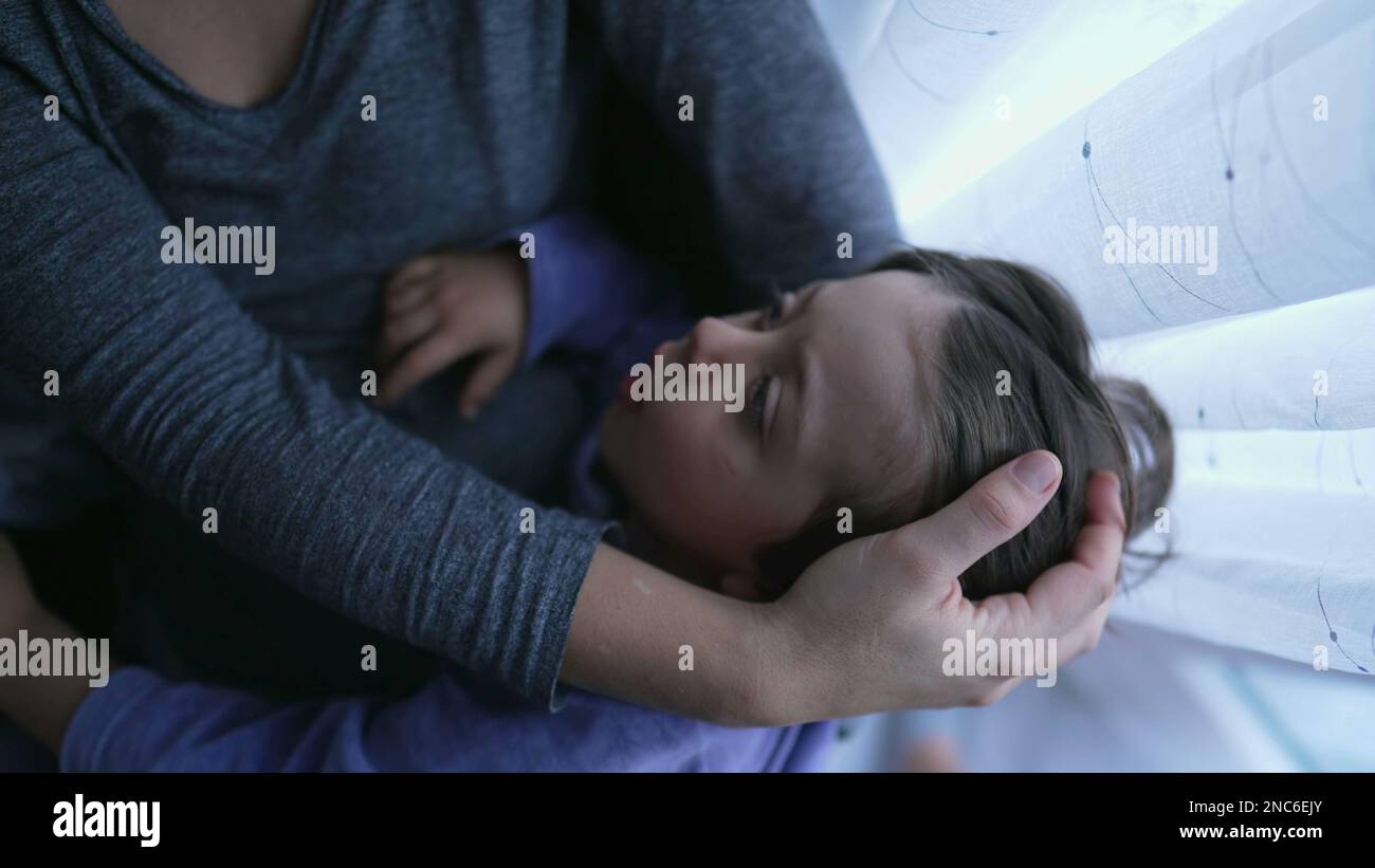 Mom tenderness moment with small boy child. Mother caressing son hair ...
