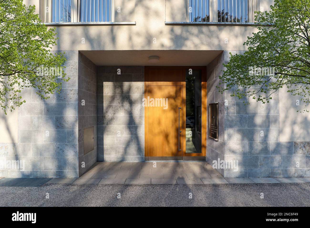 View to entrance door of a modern residential building with new ...