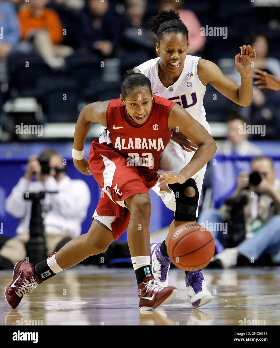 Alabama guard Ericka Russell (23) and LSU guard Katherine Graham chase ...