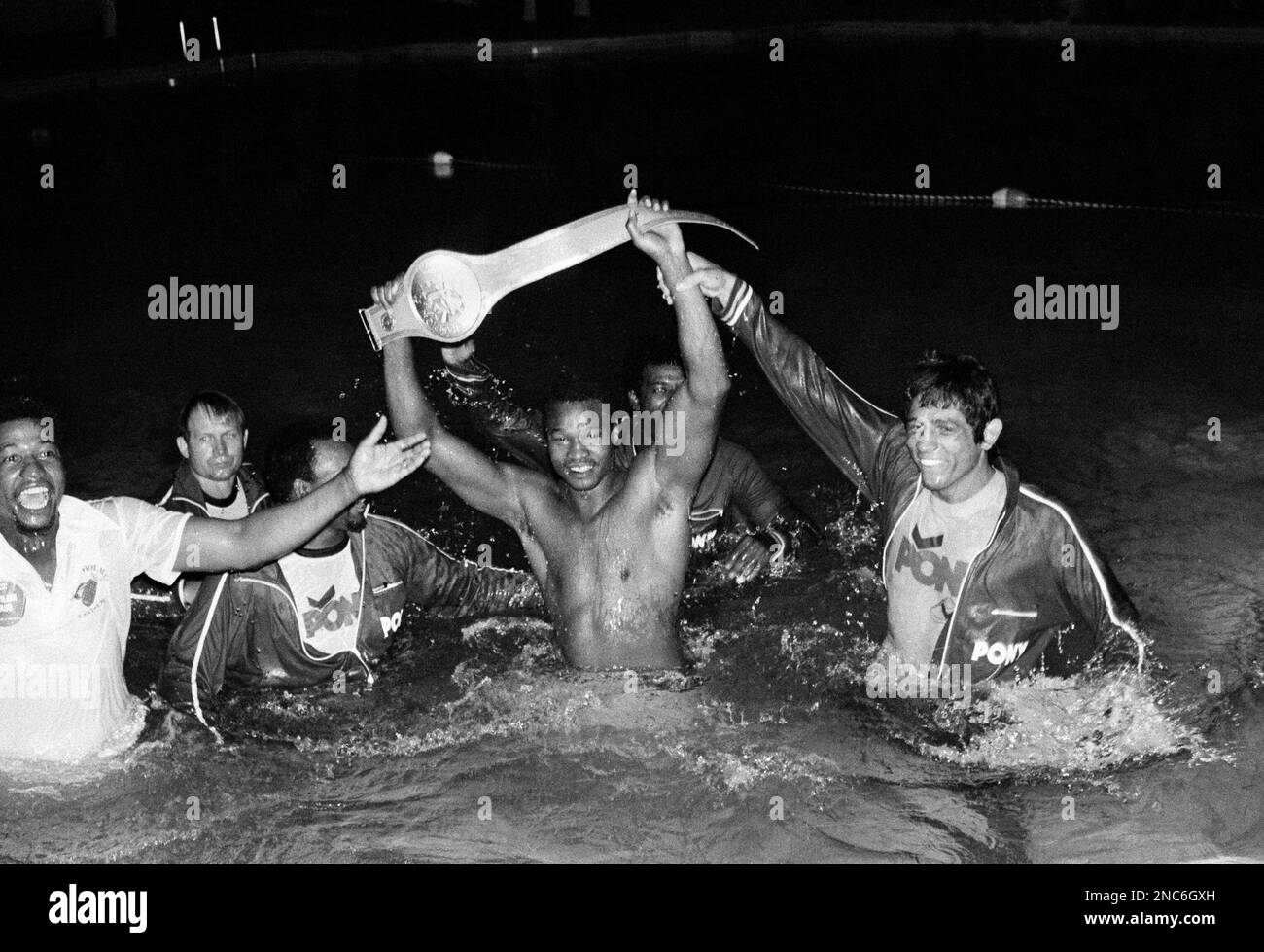 Newly crowned WBC heavyweight champion Larry Holmes shows off his title ... Newly crowned WBC heavyweight champion Larry Holmes shows off his title ...