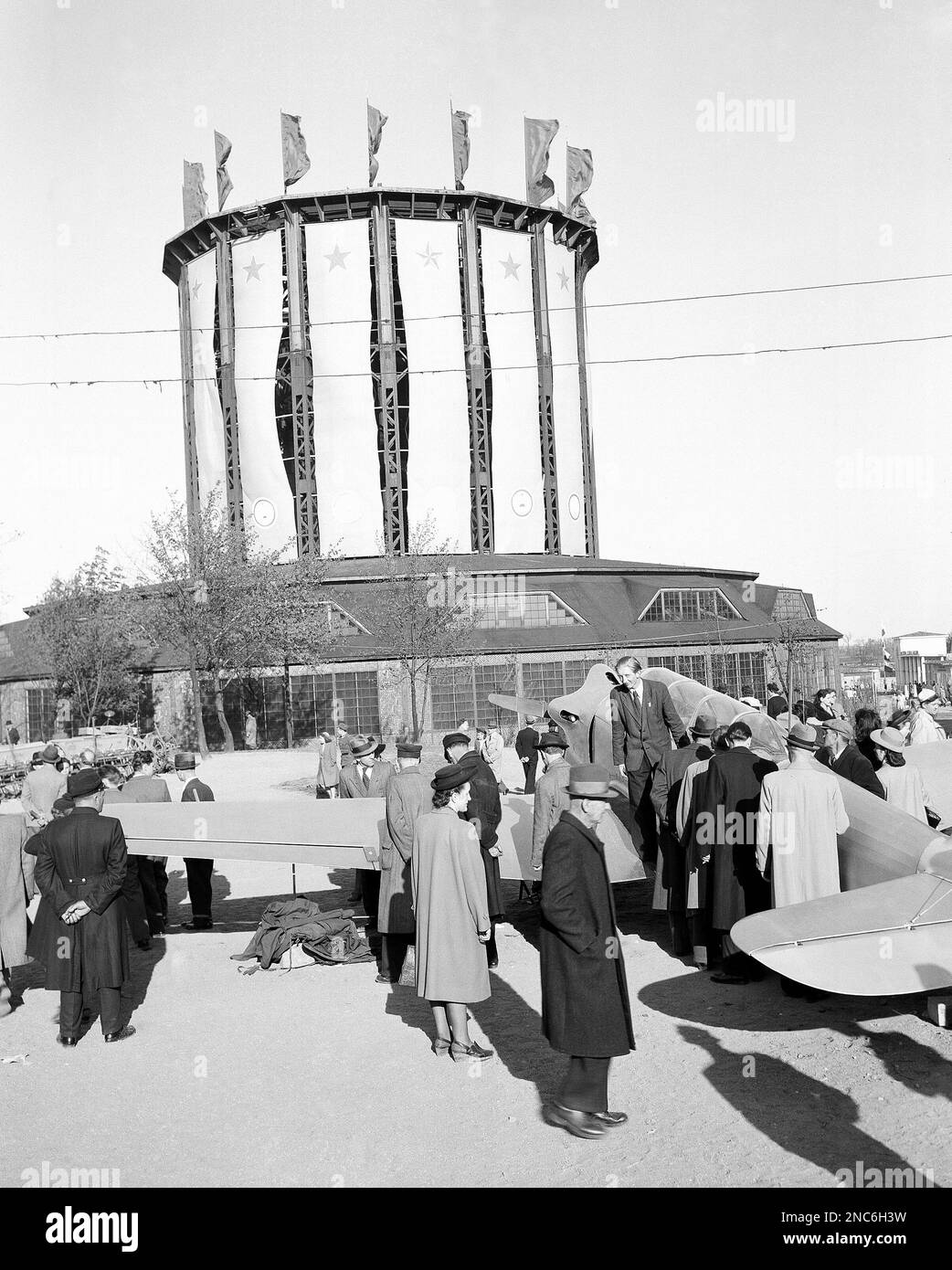 Visitors to a fair being held at Poznan, Poland, look over a Soviet ...