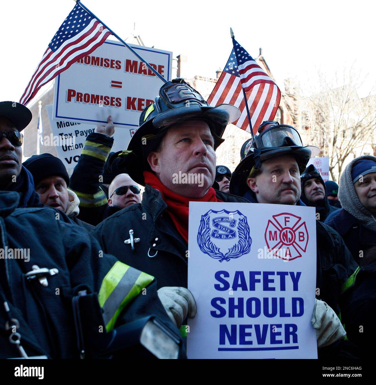 Elizabeth Fire Department firefighters Rick Maliniak, center left, and ...