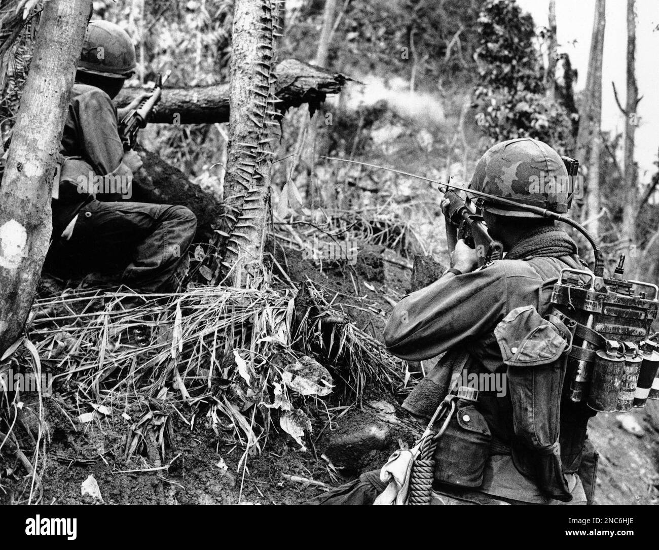 U.S. paratroopers from the Army’s 101st Division fire their rifles at ...