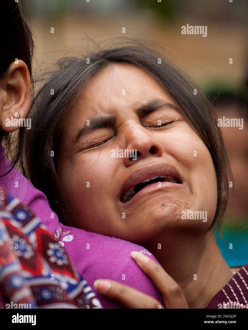 A family member of slain Christian leader Shahbaz Bhatti mourns ...