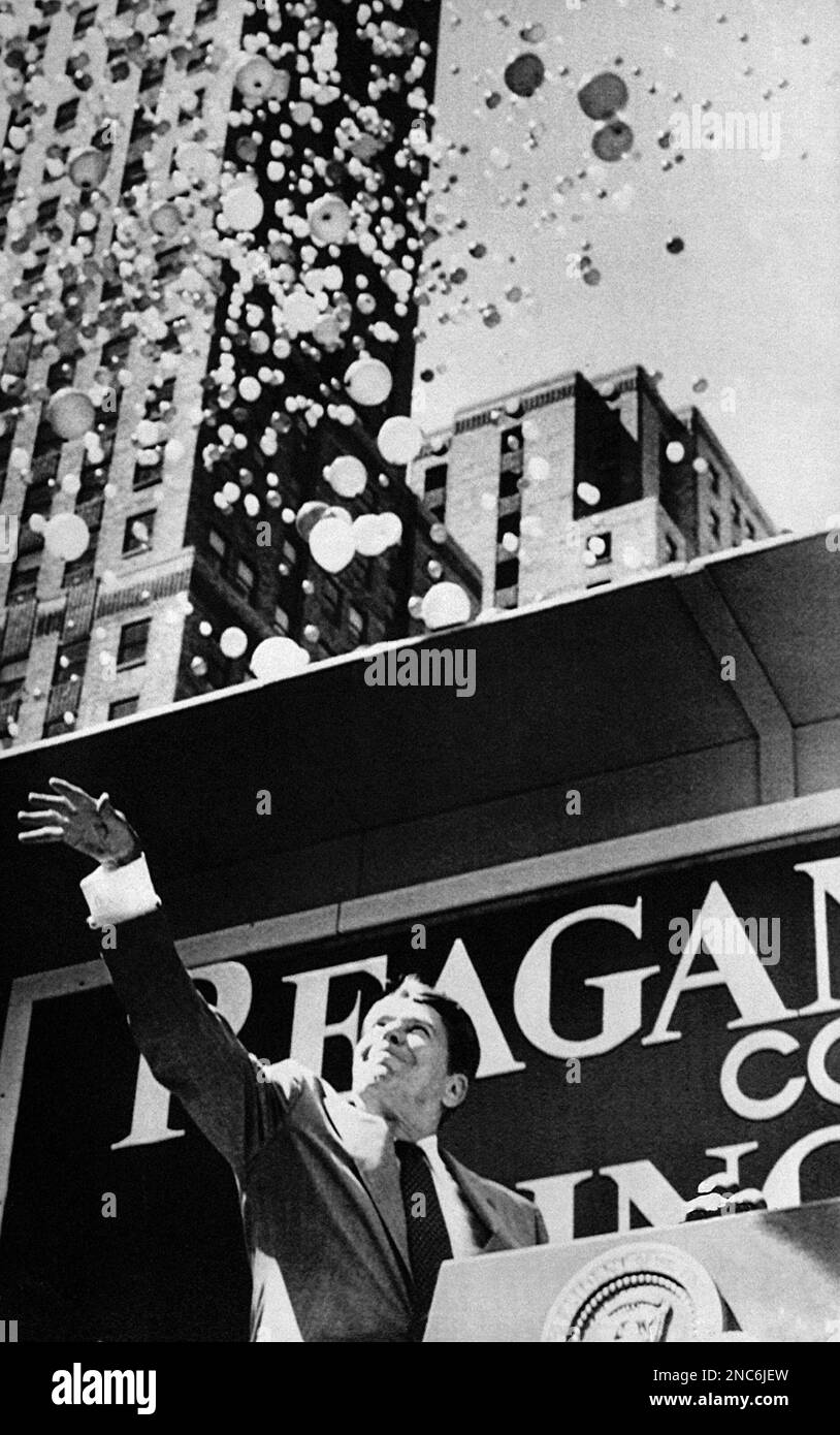 President Ronald Reagan swats at a balloon after several hundred were ...