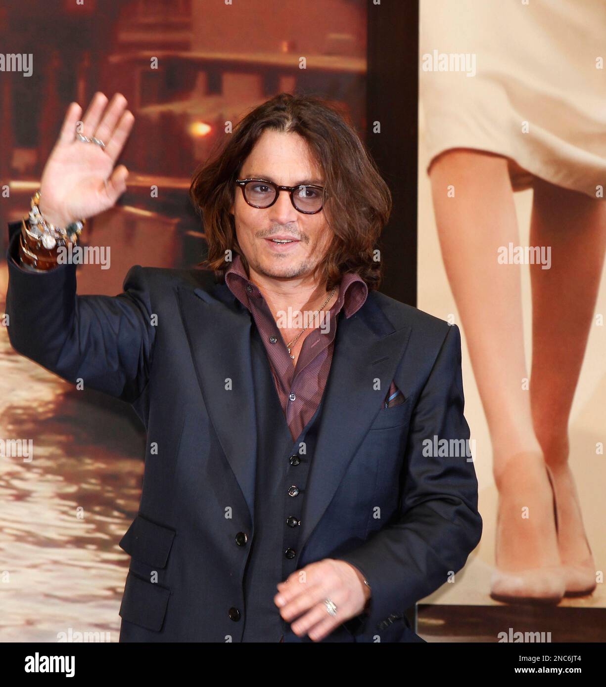 U.S. actor Johnny Depp waves for fans during the Japan premiere of his ...