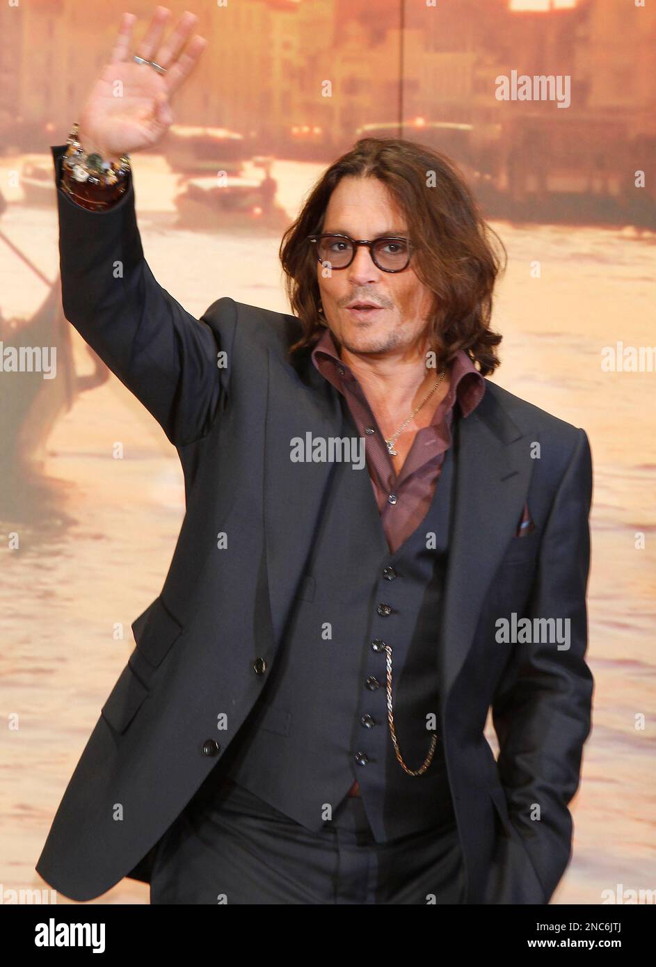 U.S. actor Johnny Depp waves for fans during the Japan premiere of his ...
