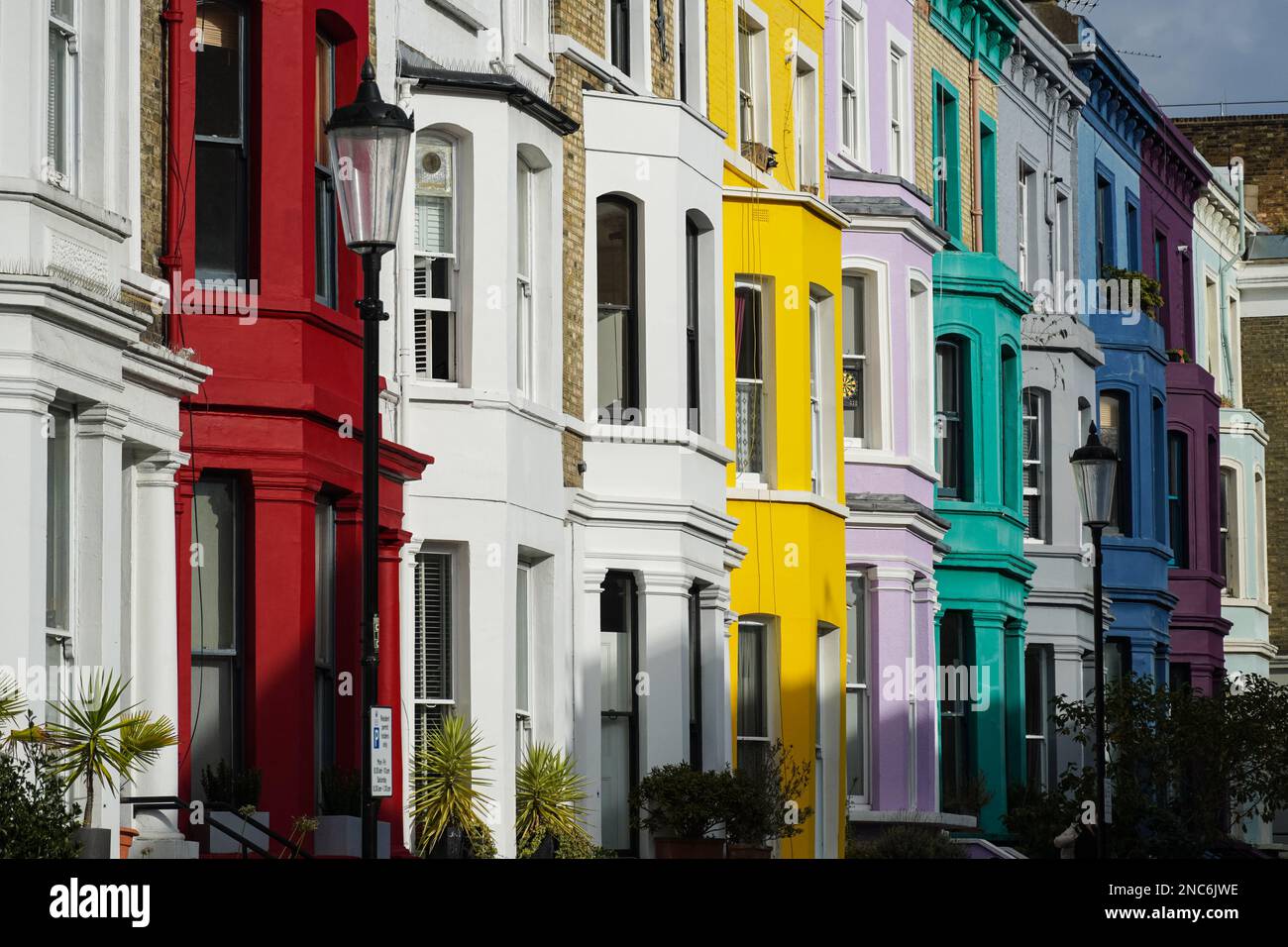 Colorful terrace houses on residential street in Notting Hill, London ...