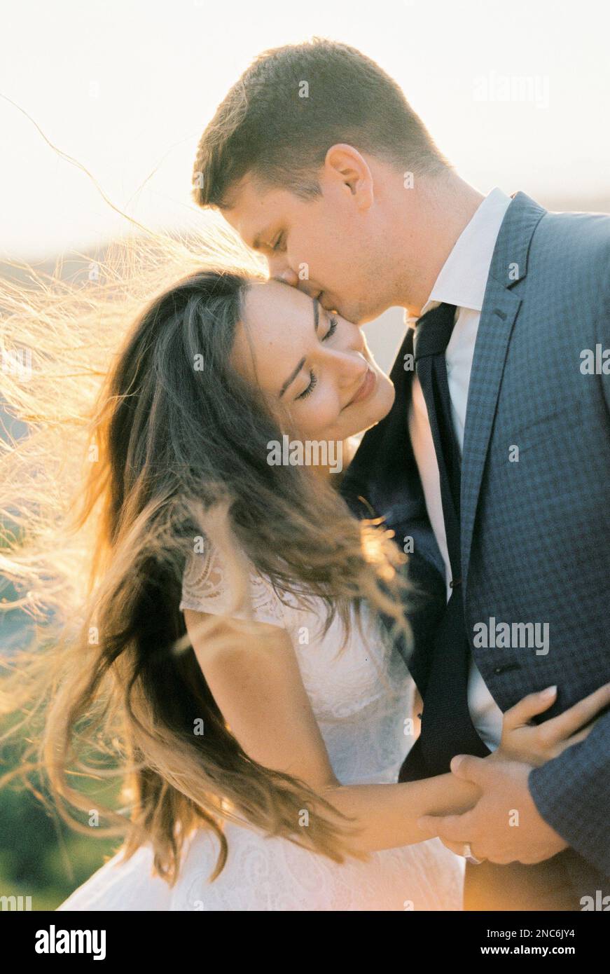 Groom kisses temple bride hi-res stock photography and images - Alamy