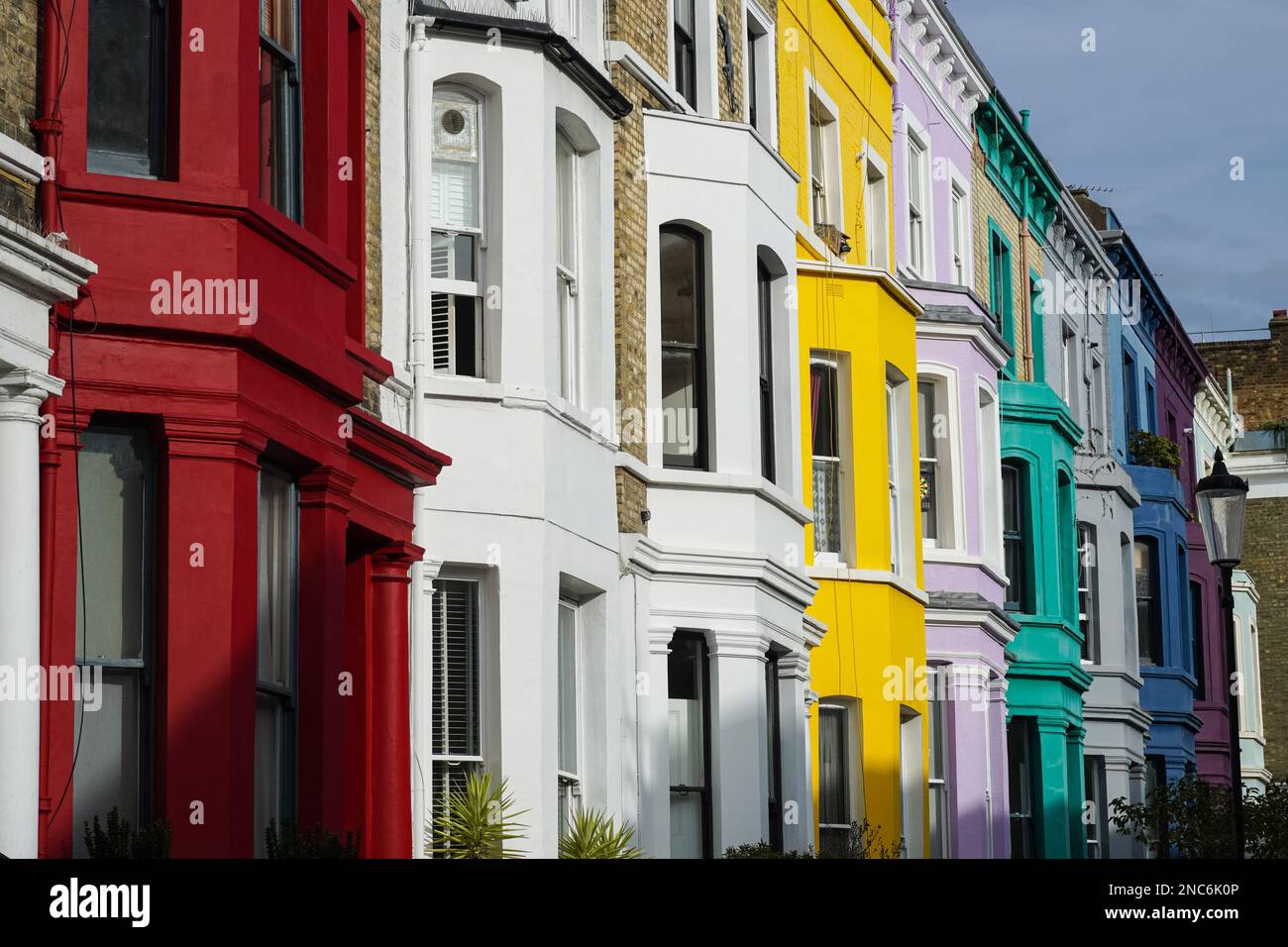 Colorful terrace houses on residential street in Notting Hill, London ...