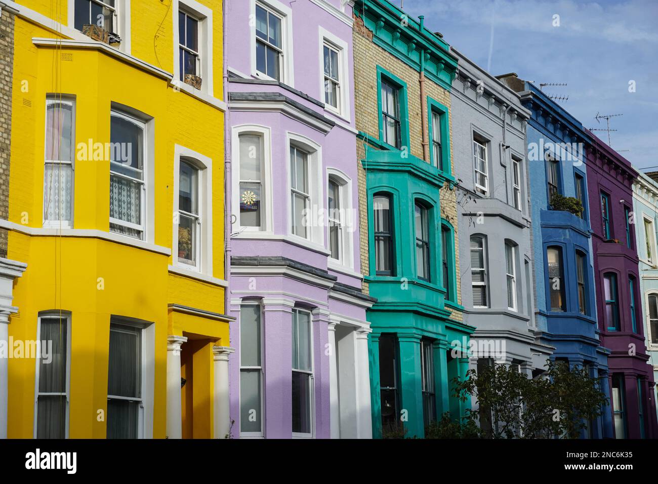 Colorful terrace houses on residential street in Notting Hill, London ...