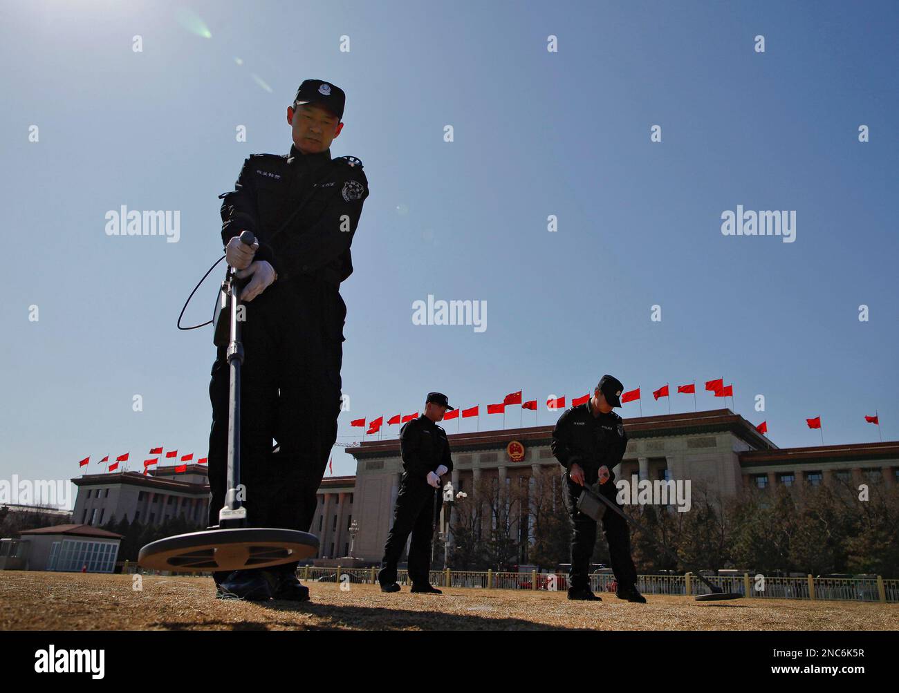 Policemen uses bomb detectors on the Tiananmen Square before the ...