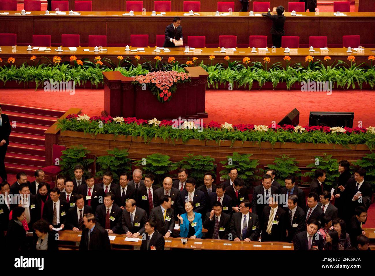 Delegates pose for a group photo after the opening session of the ...