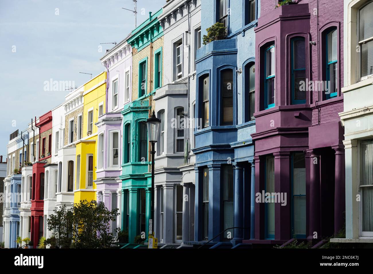 Colorful terrace houses on residential street in Notting Hill, London ...