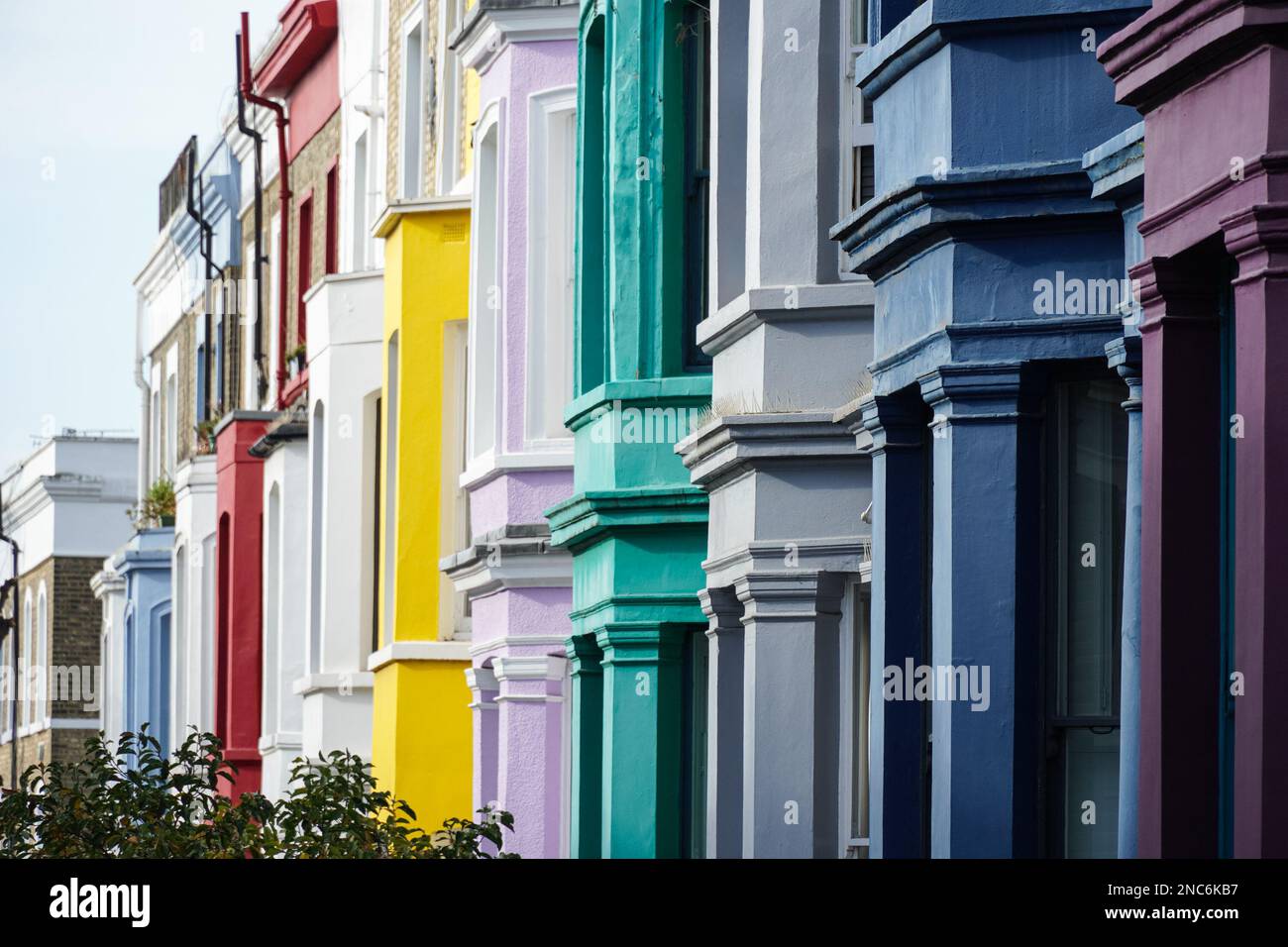 Colorful terrace houses on residential street in Notting Hill, London ...