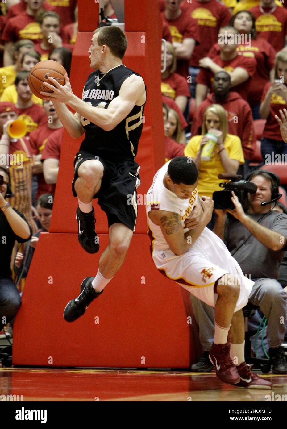 Colorado guard Levi Knutson, left, shoots next to Iowa State guard ...