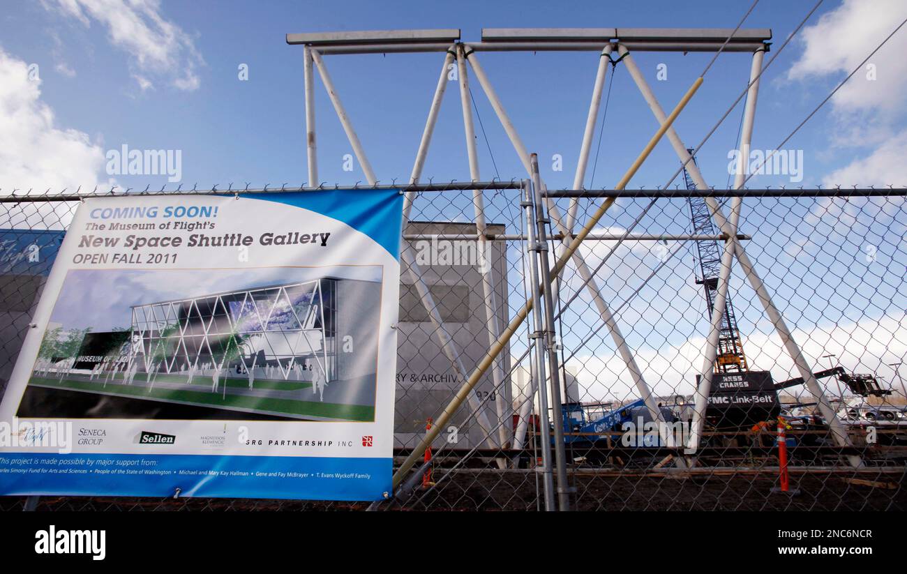 An optimistic sign showing a rendering of a space shuttle on display is ...