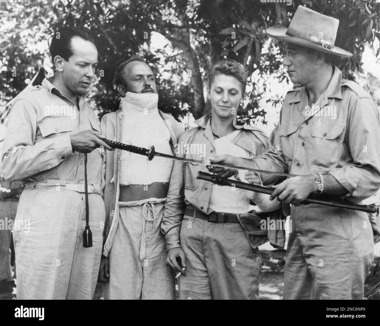 Pfc. Albert Adams (second from right) of East St. Louis, Ill., and Cpl ...