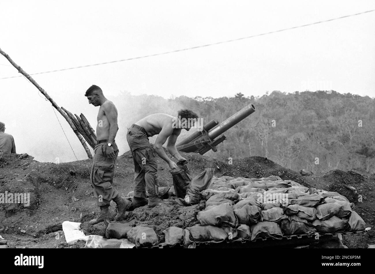 U.S. artillerymen fire their 155 mm Howitzer from their position at ...