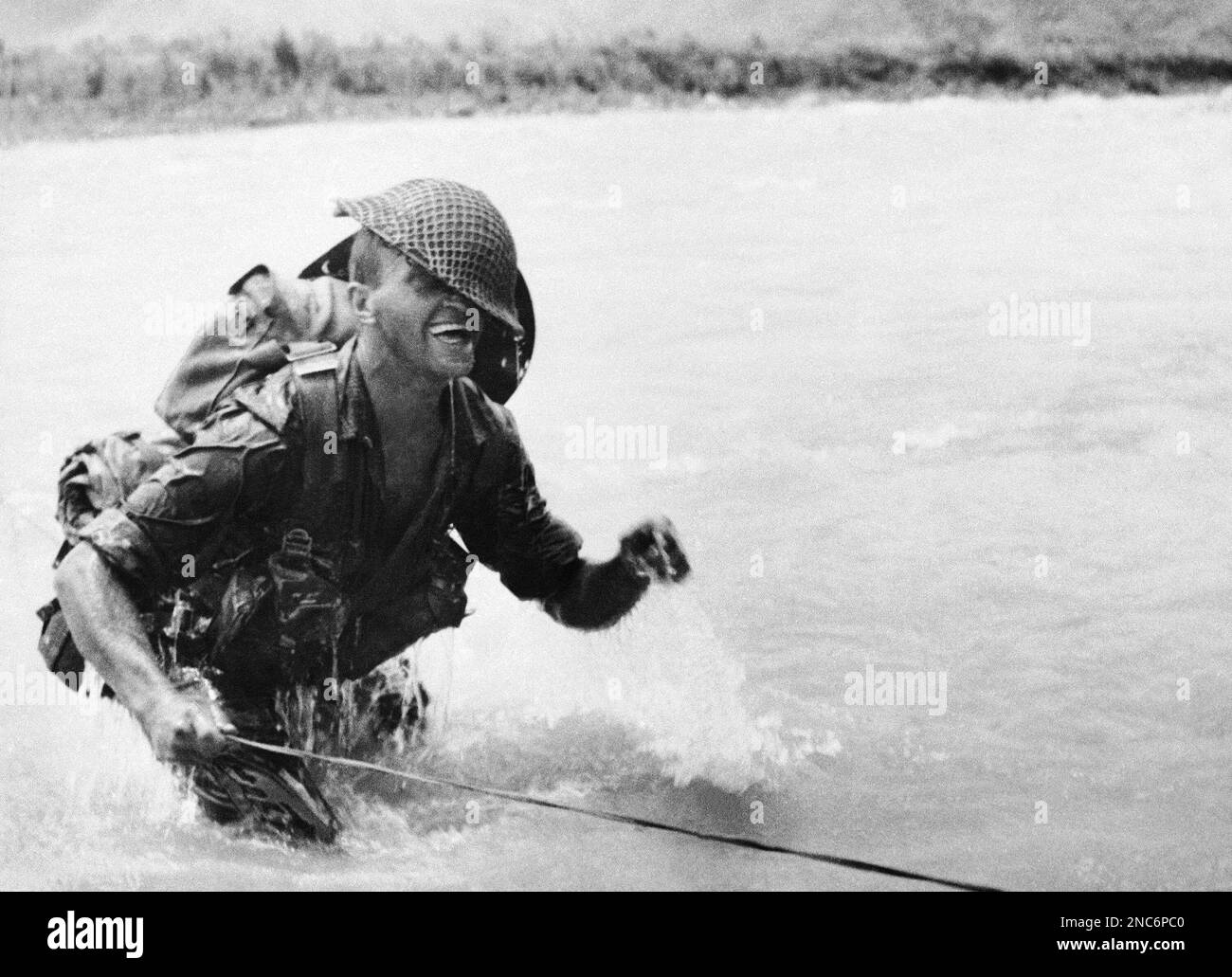A private in the Australian Army gets a ducking while crossing the ...