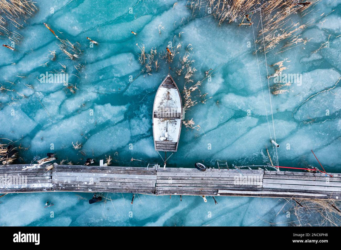 Icy lake Balaton with boat Stock Photo - Alamy