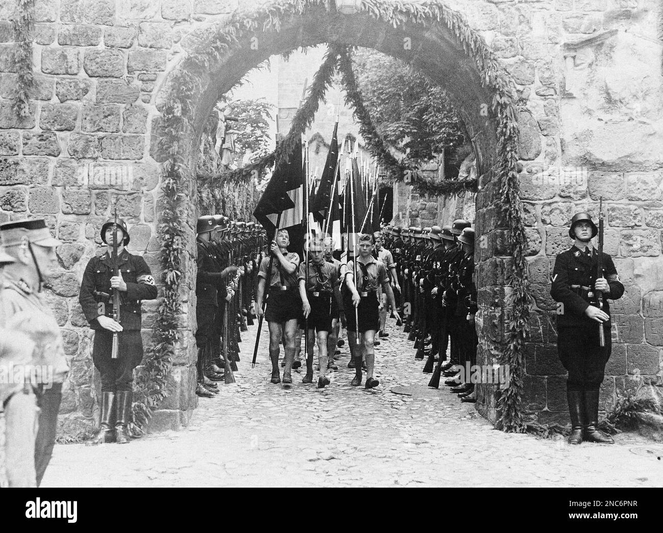 Hitler Youth bear their colors in the "Schloss" at Quedlinburg, Germany ...