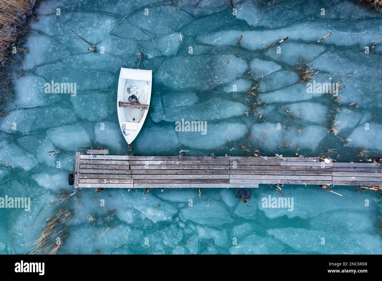 Icy lake Balaton with boat Stock Photo - Alamy