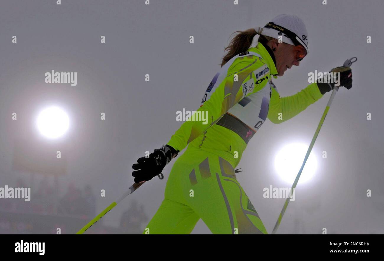 Petra Majdic of Slovenia competes in foggy weather during the women's 1 ...