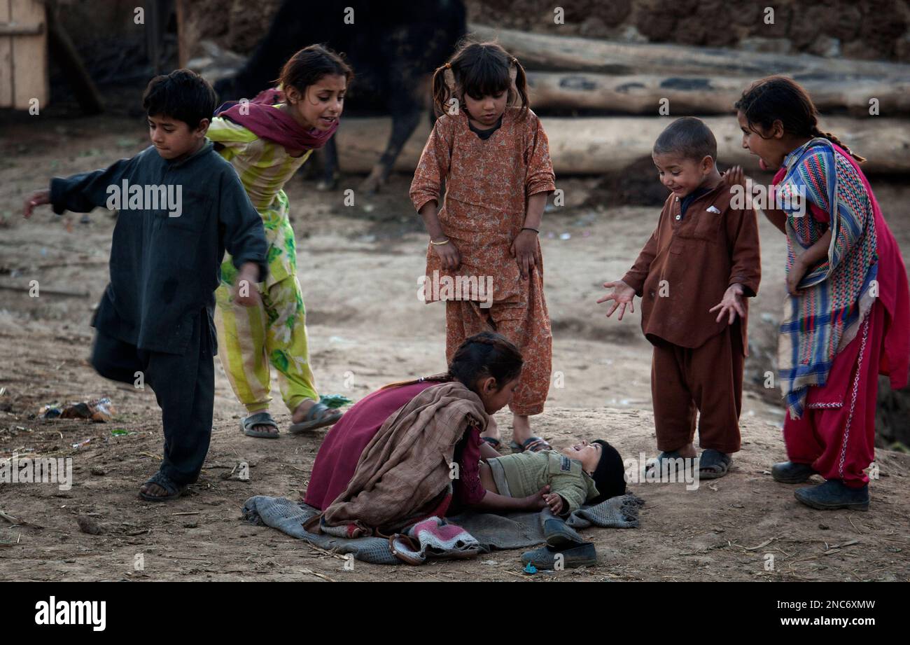 Pakistani children who fled their villages with family members due to ...