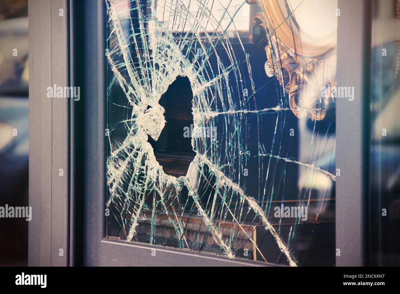 Broken window shop with smashed glass Stock Photo - Alamy