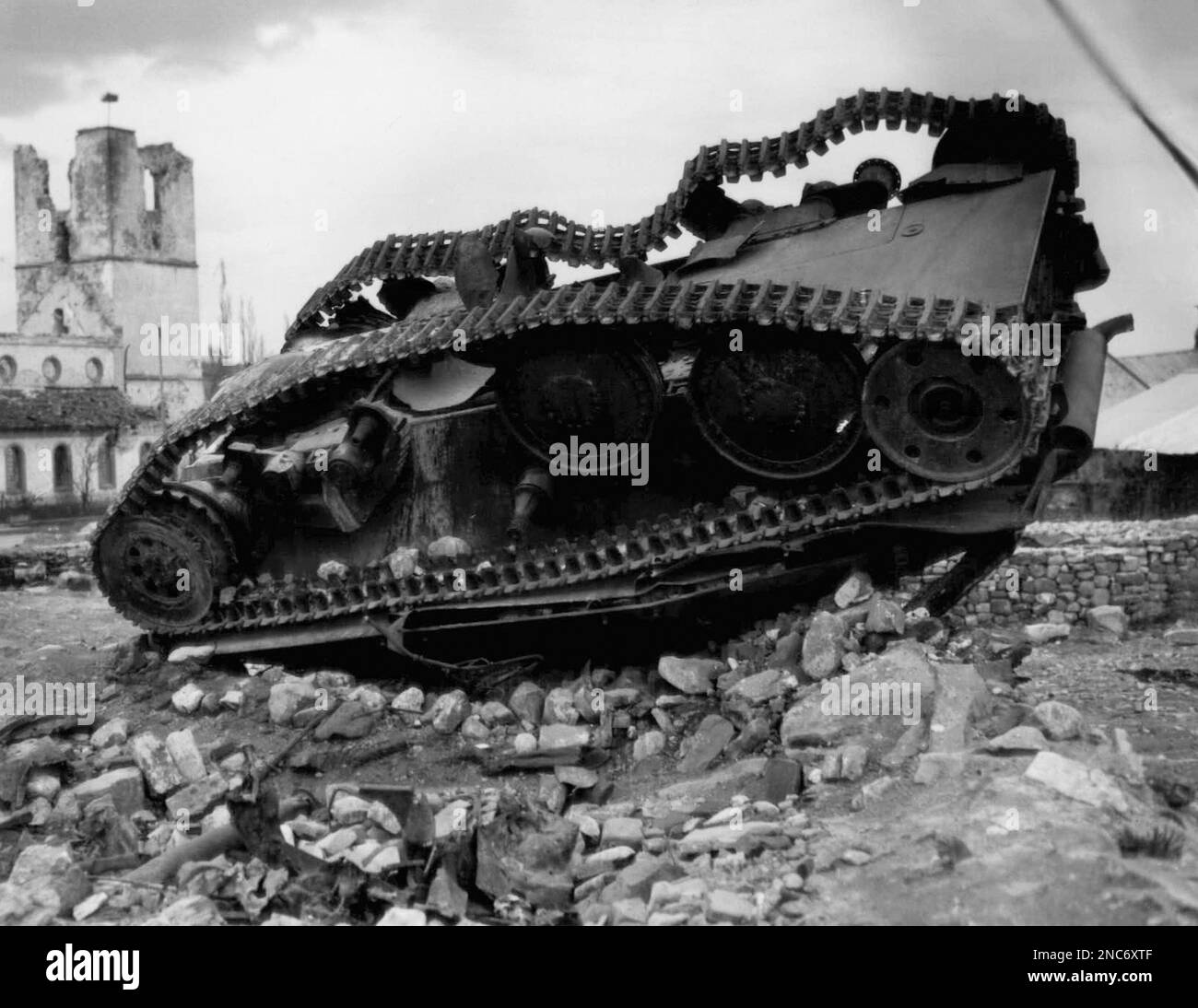 An overturned tank, rubble and the smashed church at Mittelwehr present ...