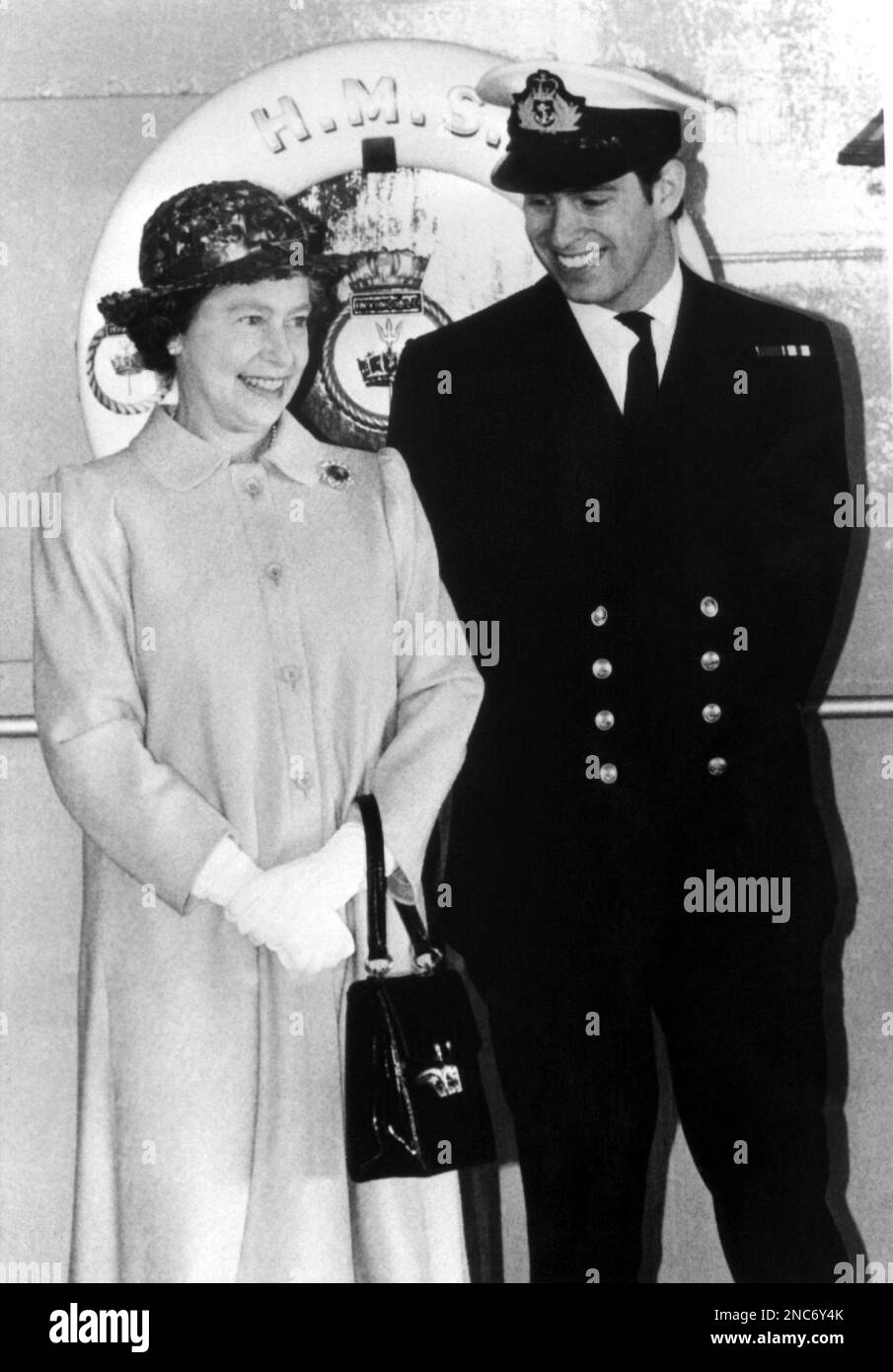 Britain’s Queen Elizabeth II with her son Prince Andrew on board HMS ...