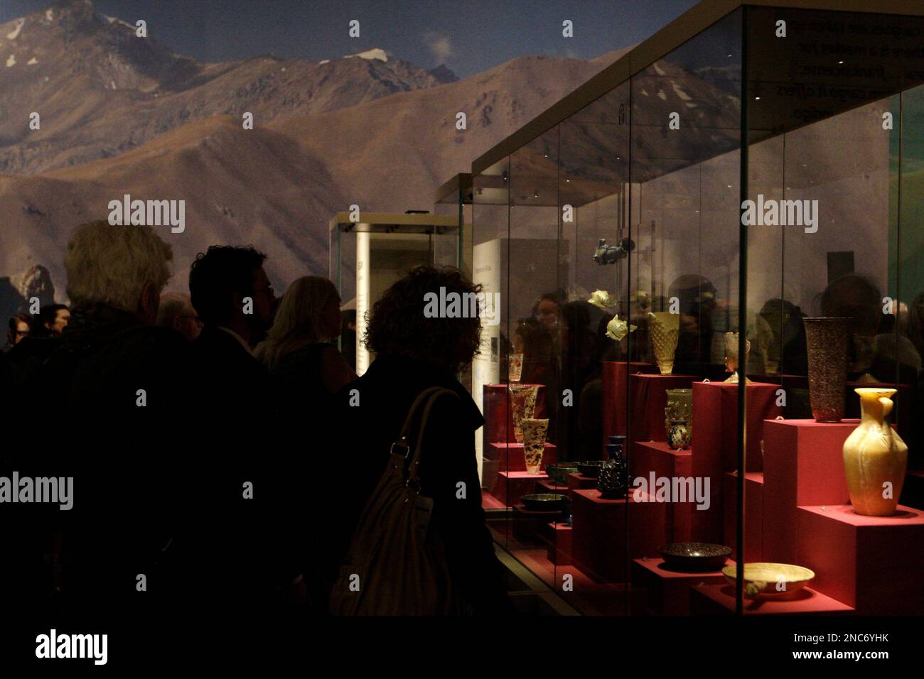 Visitors look at exhibits on display in an exhibition 'Afghanistan ...