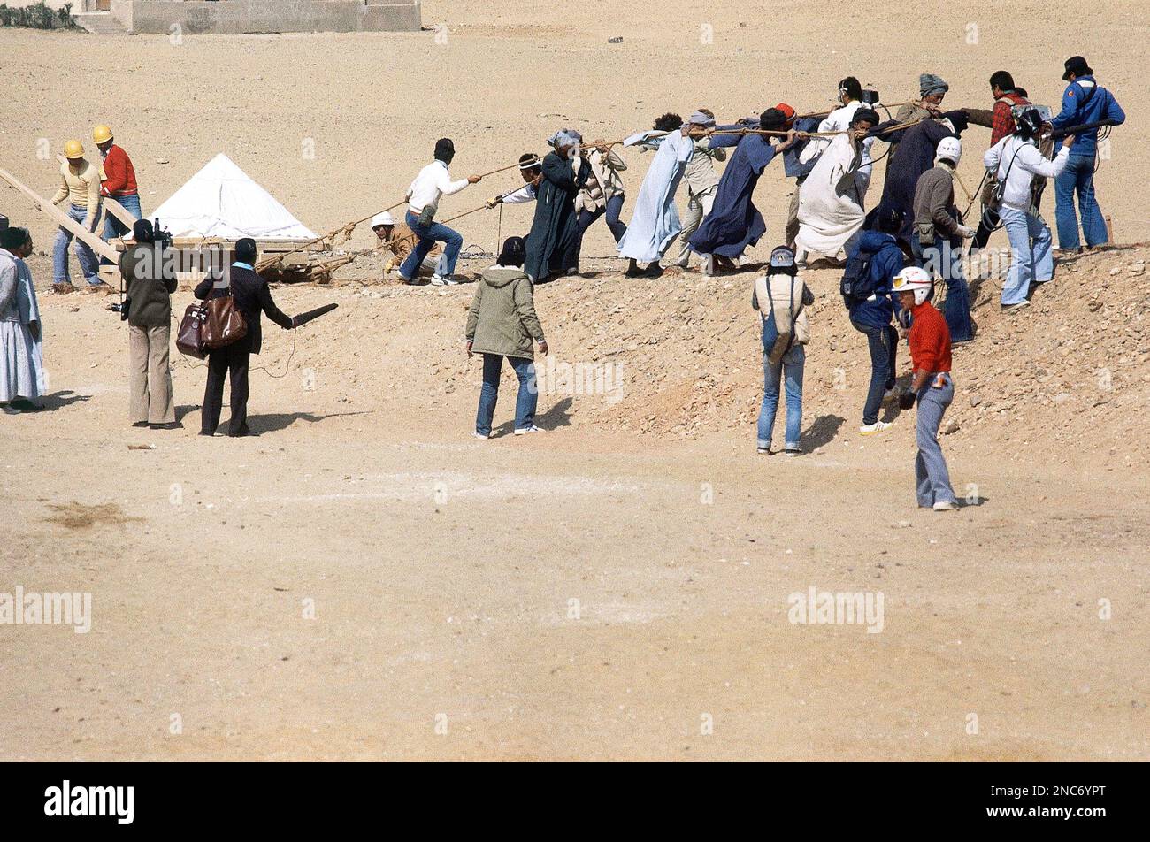 Egyptian workers use a sled fashioned after ancient ones found in ...