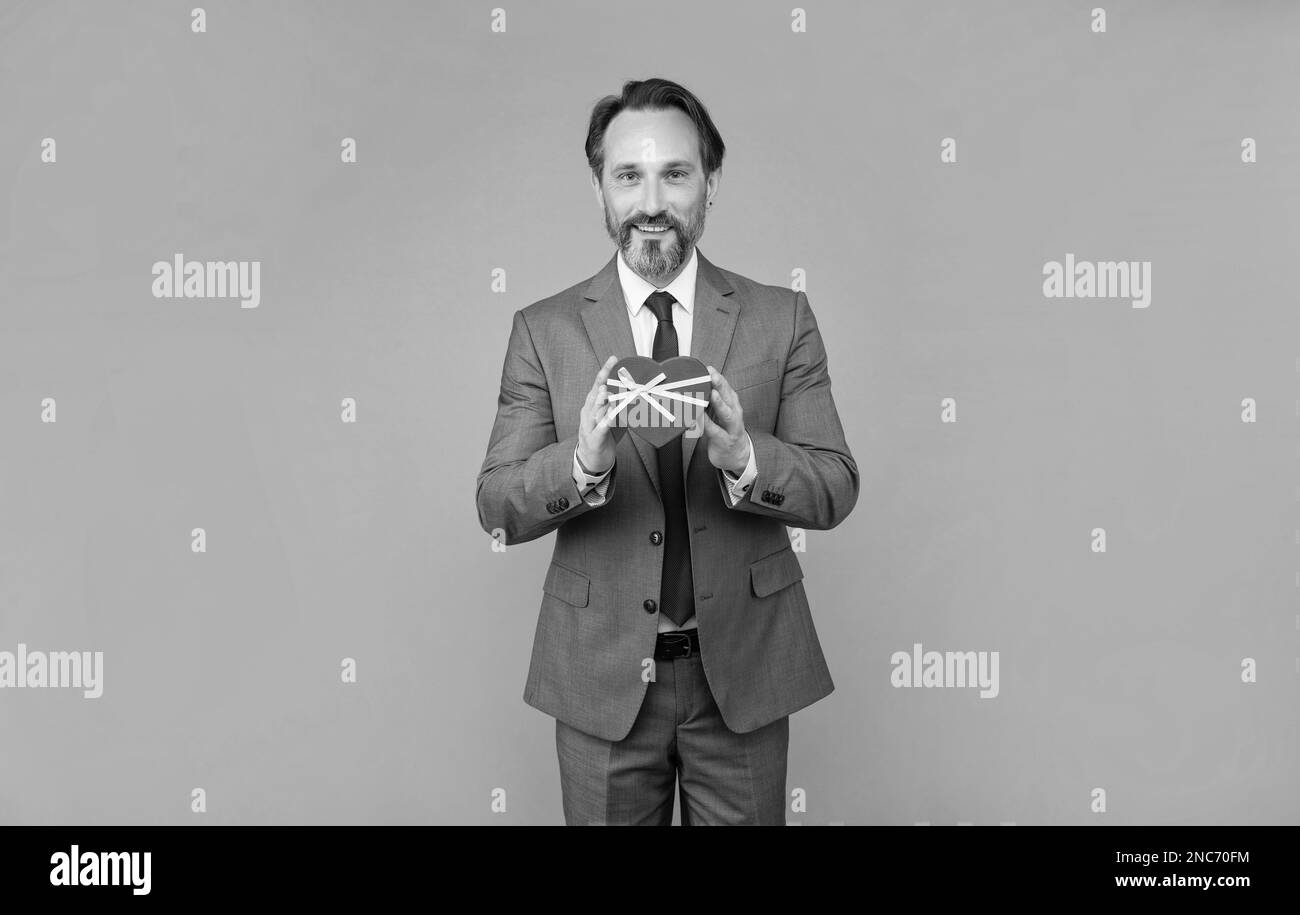 Man hold birthday present Black and White Stock Photos & Images - Alamy