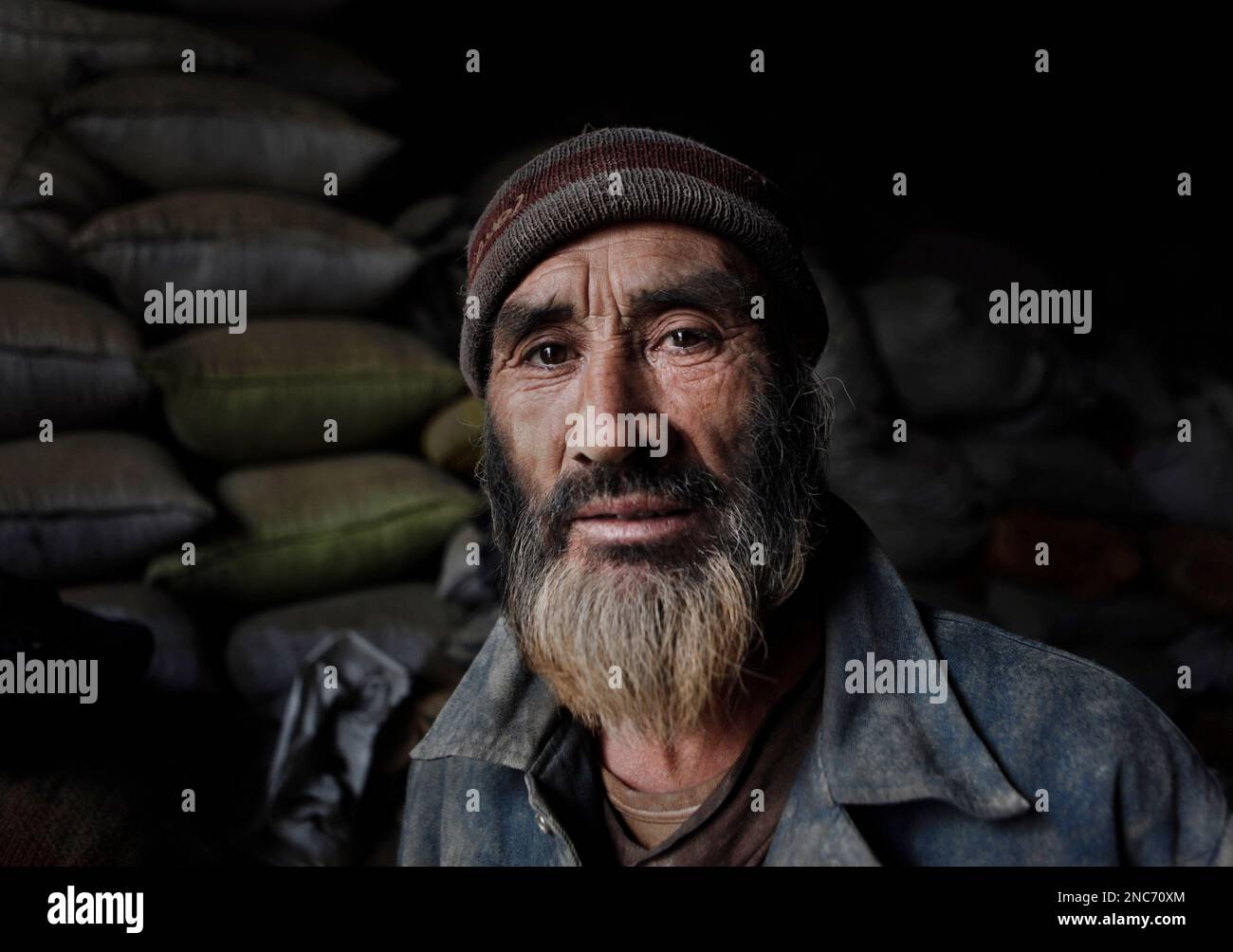 Kifayat-ullah, an Afghan man poses for picture inside his flour mill in ...