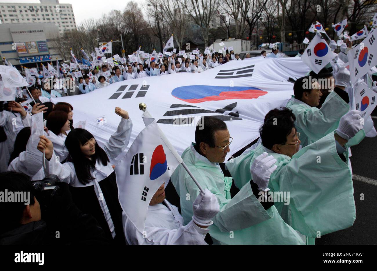 South Korean wearing traditional Korean costumes wave the national ...