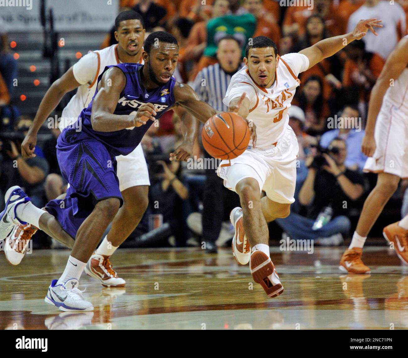Texas guard Cory Joseph, right, races for the loose ball with Kansas ...