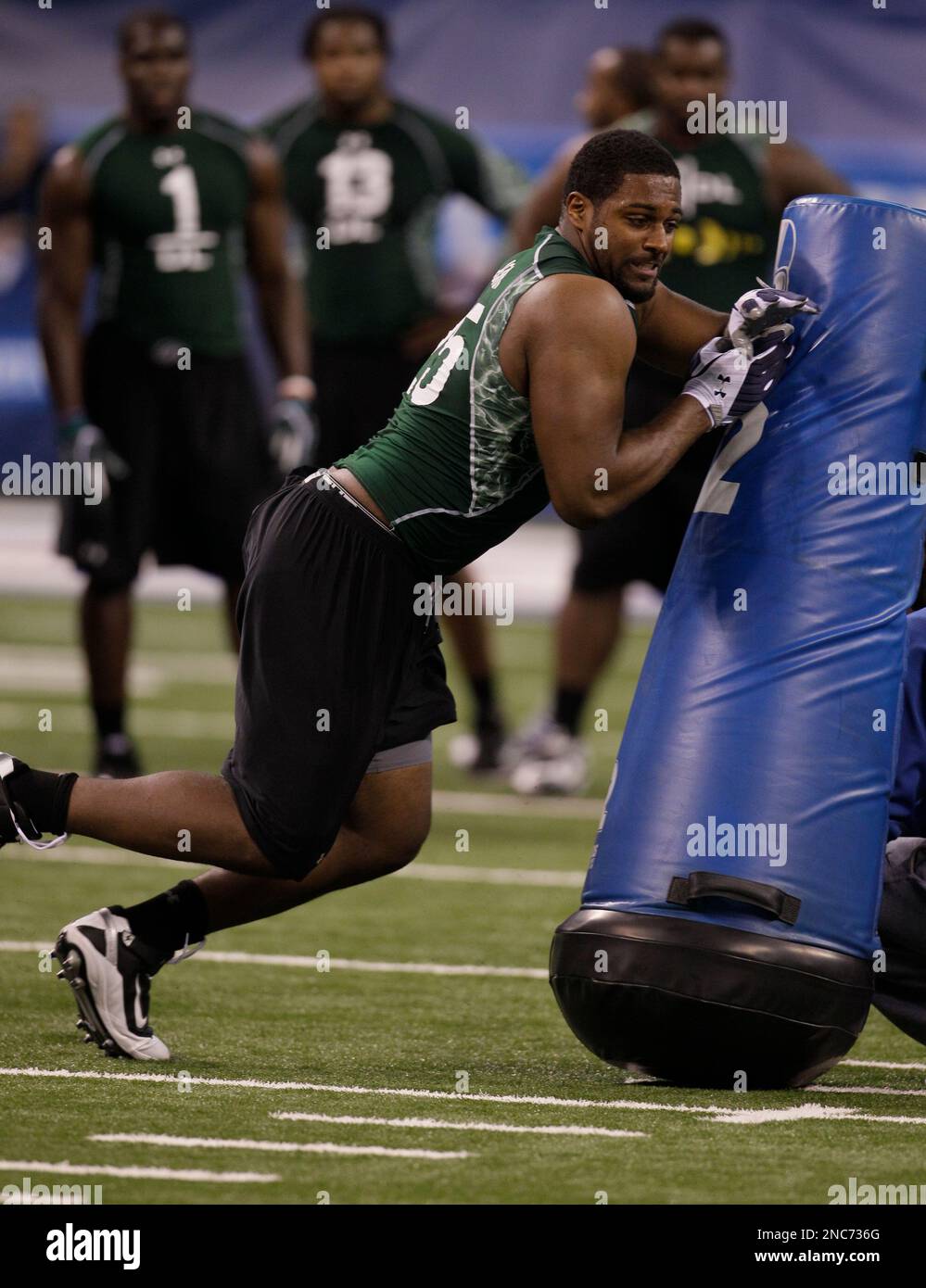 California defensive end Cameron Jordan runs a drill during the NFL football scouting combine in ...