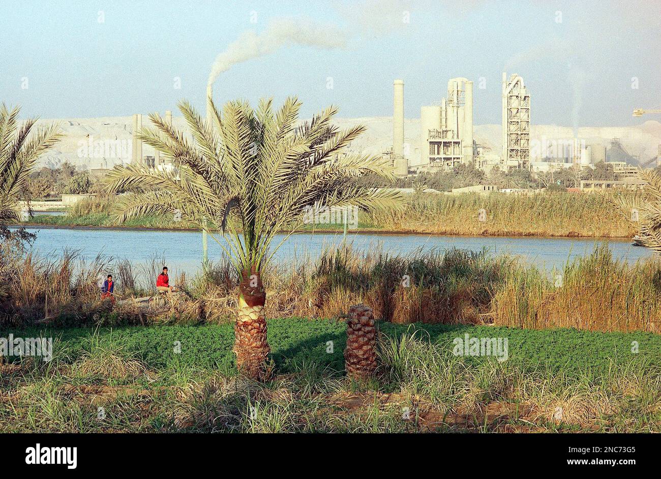 The Nile River is edged with some greenery in the surrounding desert as ...