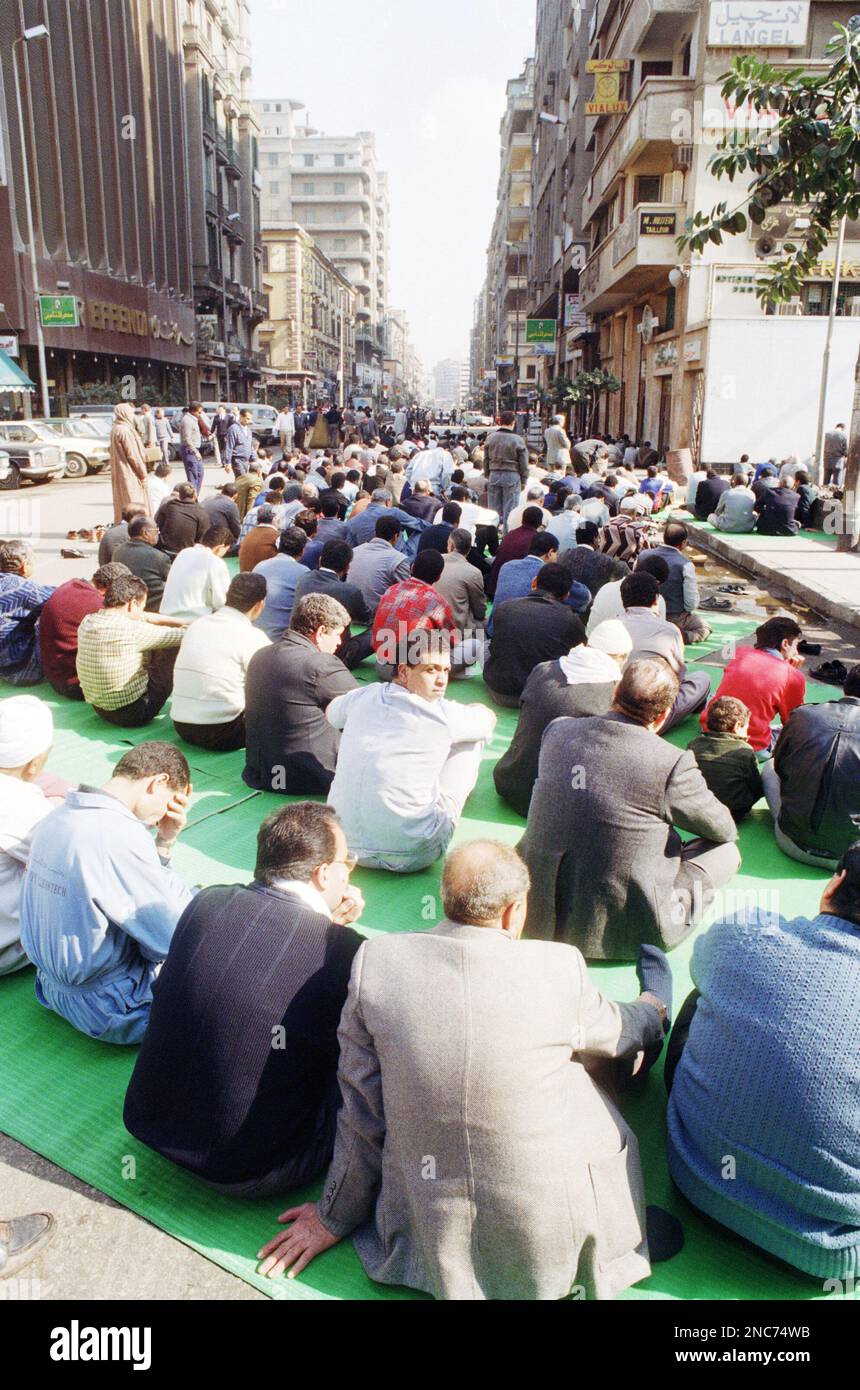 Muslim faithful attend Friday prayers on Cairo’s streets listen to a ...