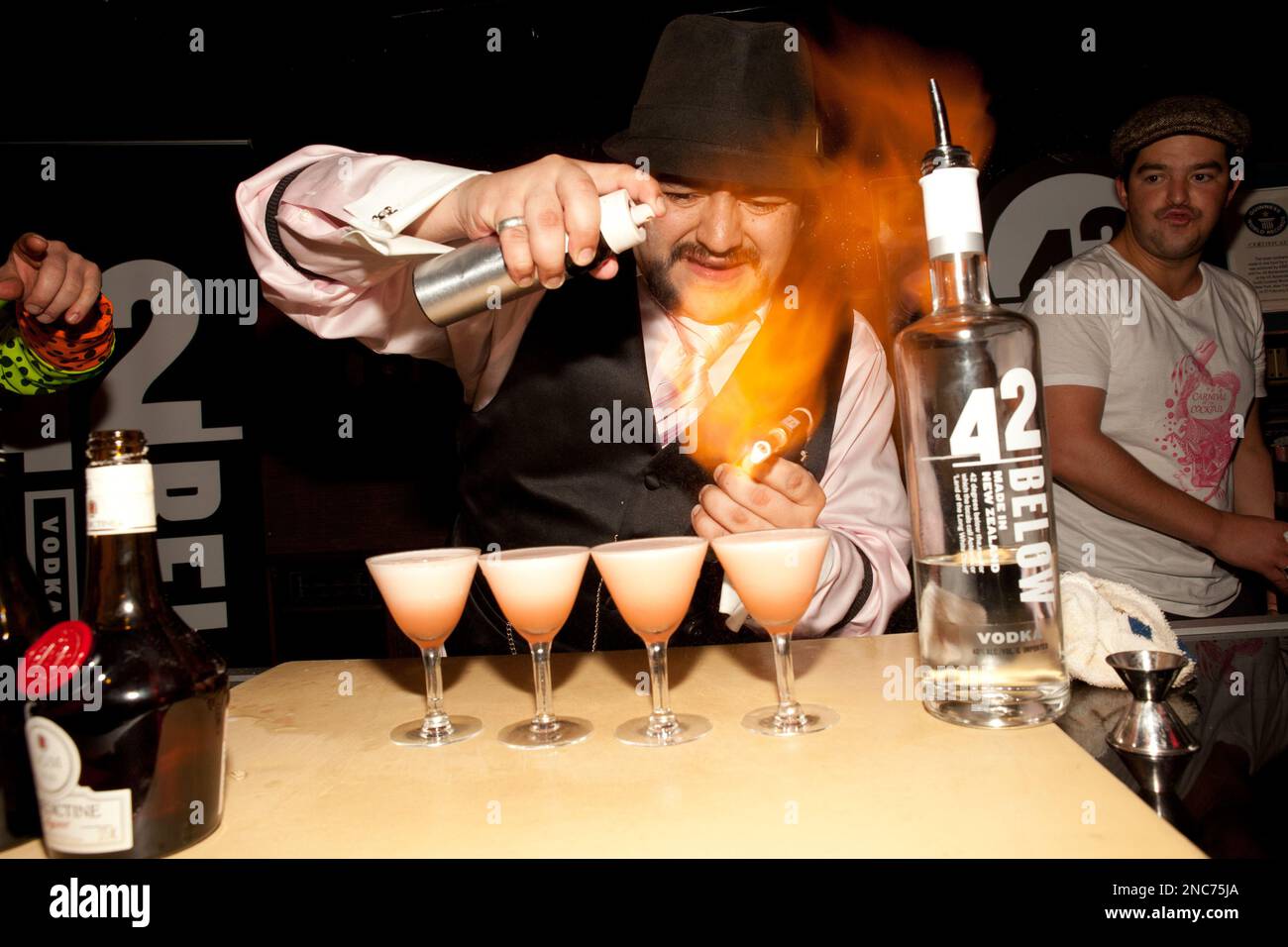 Mixologiests prepare a flaming cocktail at the 42BELOW Cocktail World ...