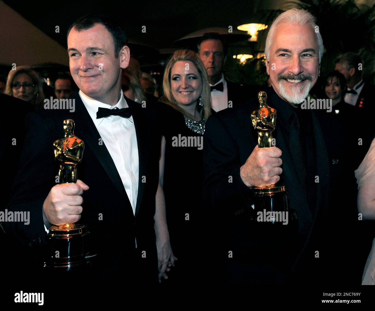 Dave Elsey, left, and Rick Baker are seen with their academy awards for ...