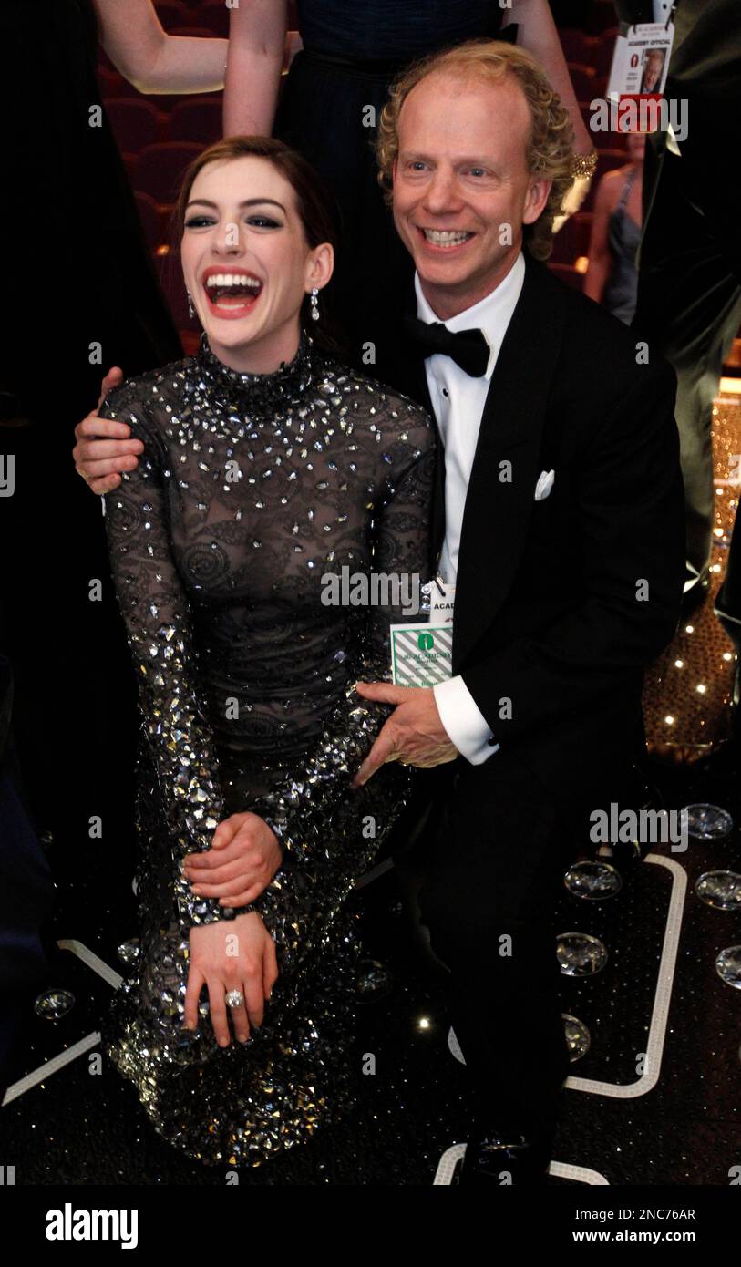 Anne Hathaway, left, and producer Bruce Cohen pose at the 83rd Academy ...