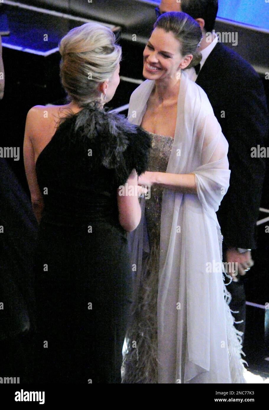 Actresses Sharon Stone, left, and Hilary Swank are seen during the 83rd ...