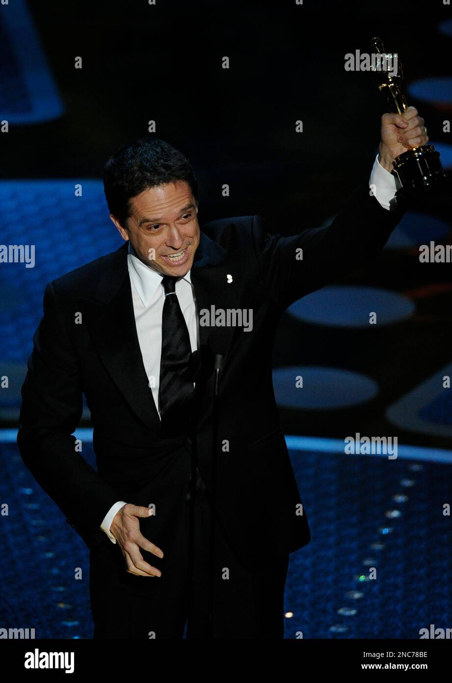 Lee Unkrich accepts the Oscar for best animated feature film for "Toy ...