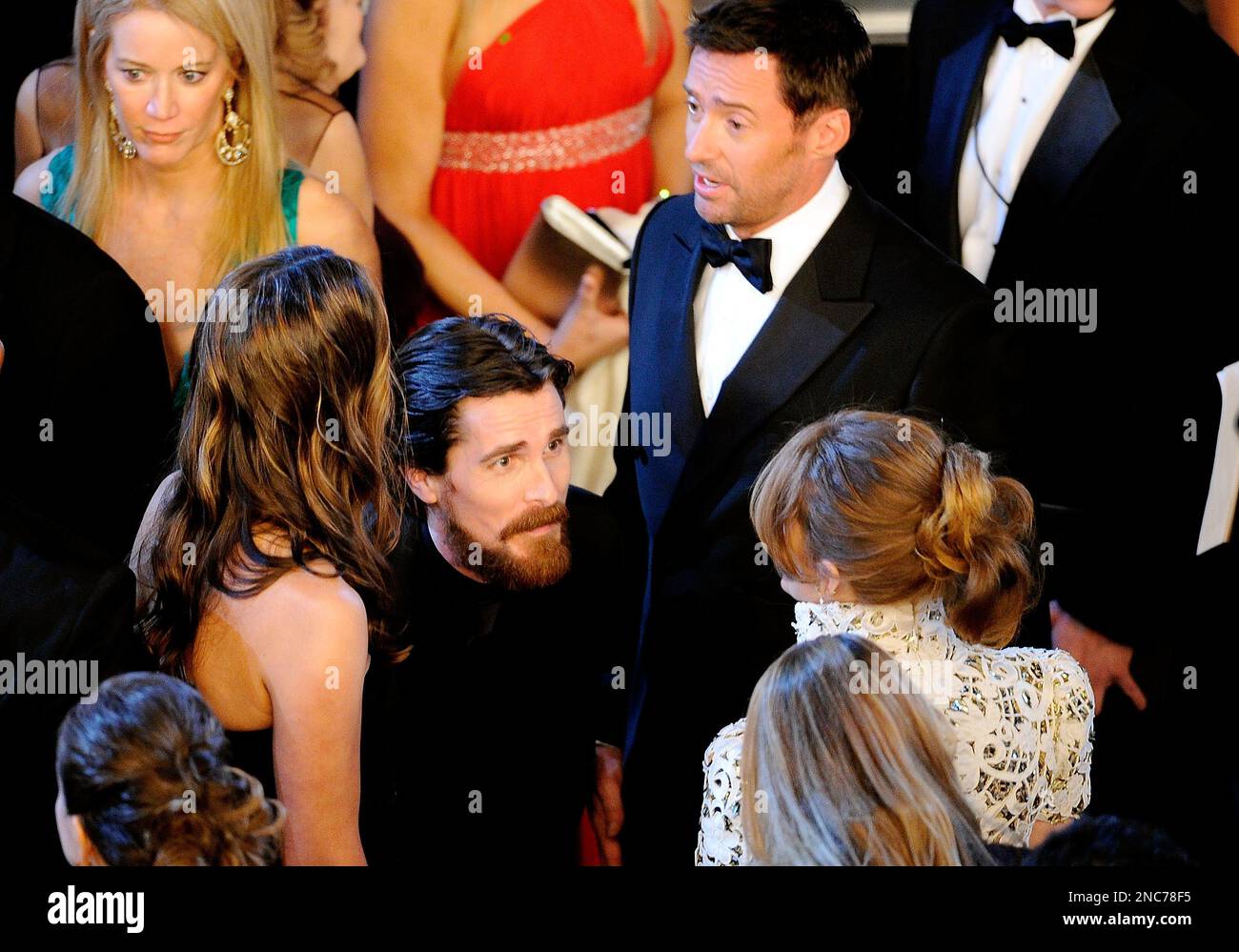 Actors Christian Bale, left, and Hugh Jackman, right, talk with actress ...