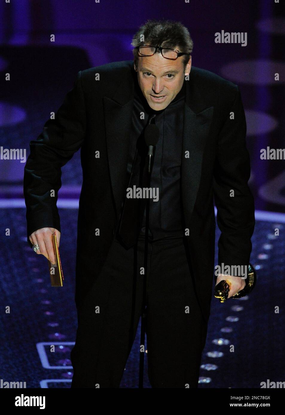 Wally Pfister accepts the Oscar for best achievement in cinematography ...