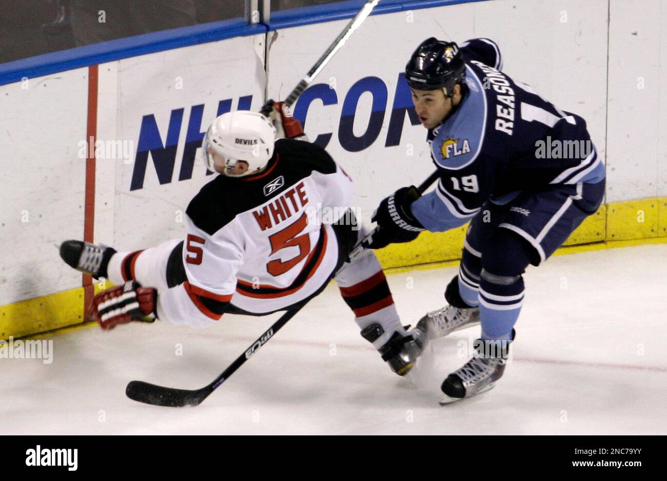 New Jersey Devils' Colin White (5) is knocked to the ice by Florida ...